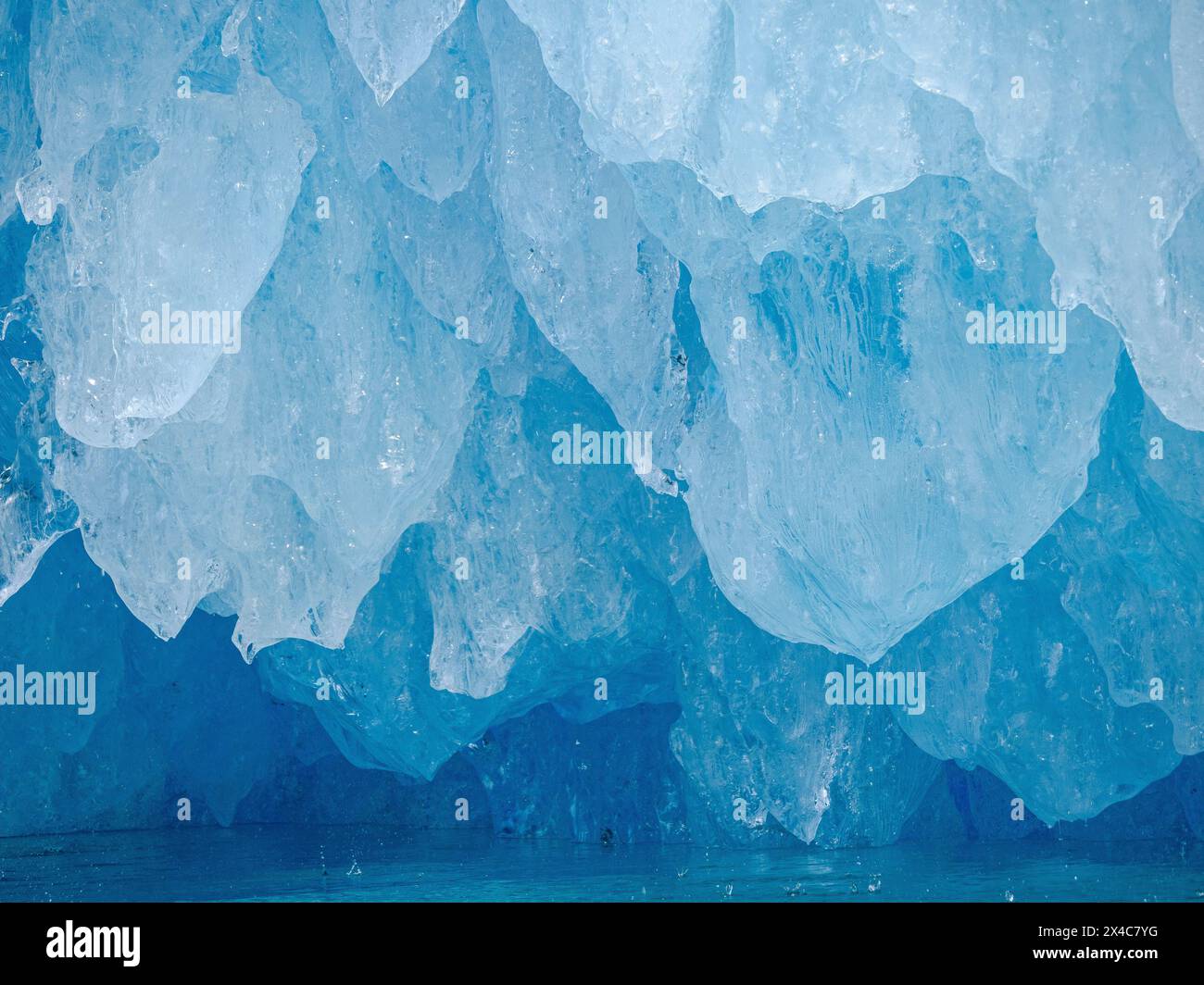 Iceberg in the fjord with melt structure. Landscape in the Johan ...