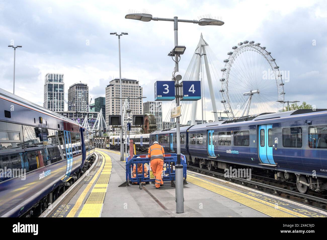 London, UK. Men working on a platform of Charing Cross Station. London ...