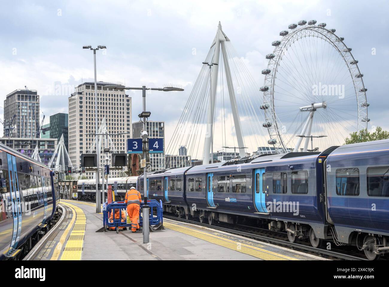 London, UK. Men working on a platform of Charing Cross Station. London ...