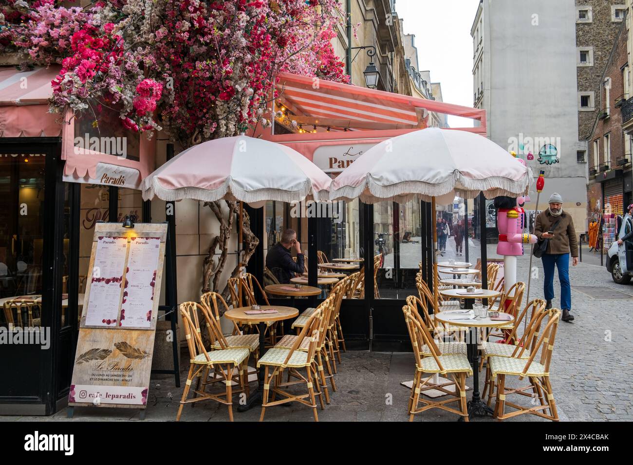Paris, France - March 11, 2024. "Le Paradis" cafe and restaurant on the ...