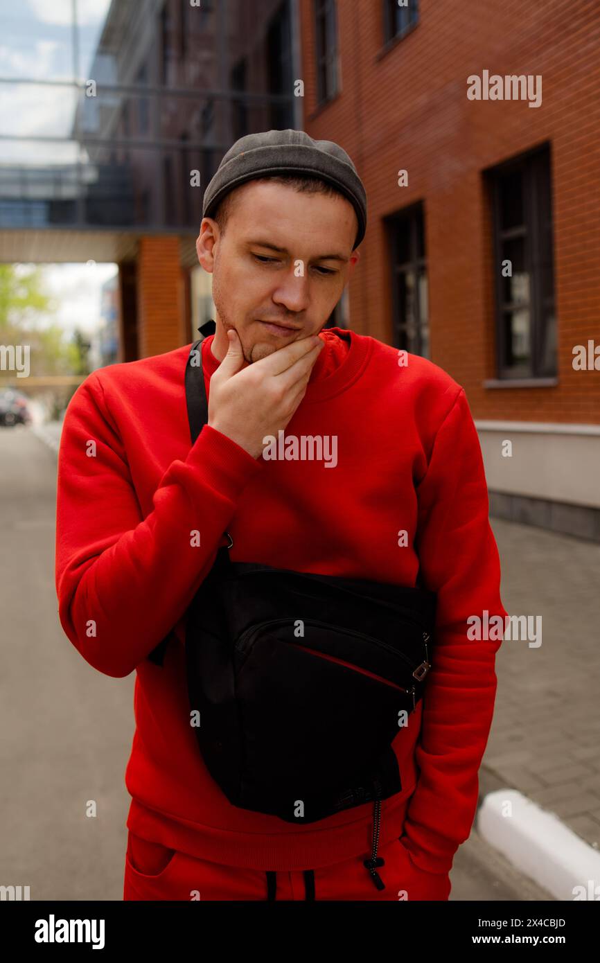 Man in Red Sweater and Black Fanny Pack Stock Photo - Alamy