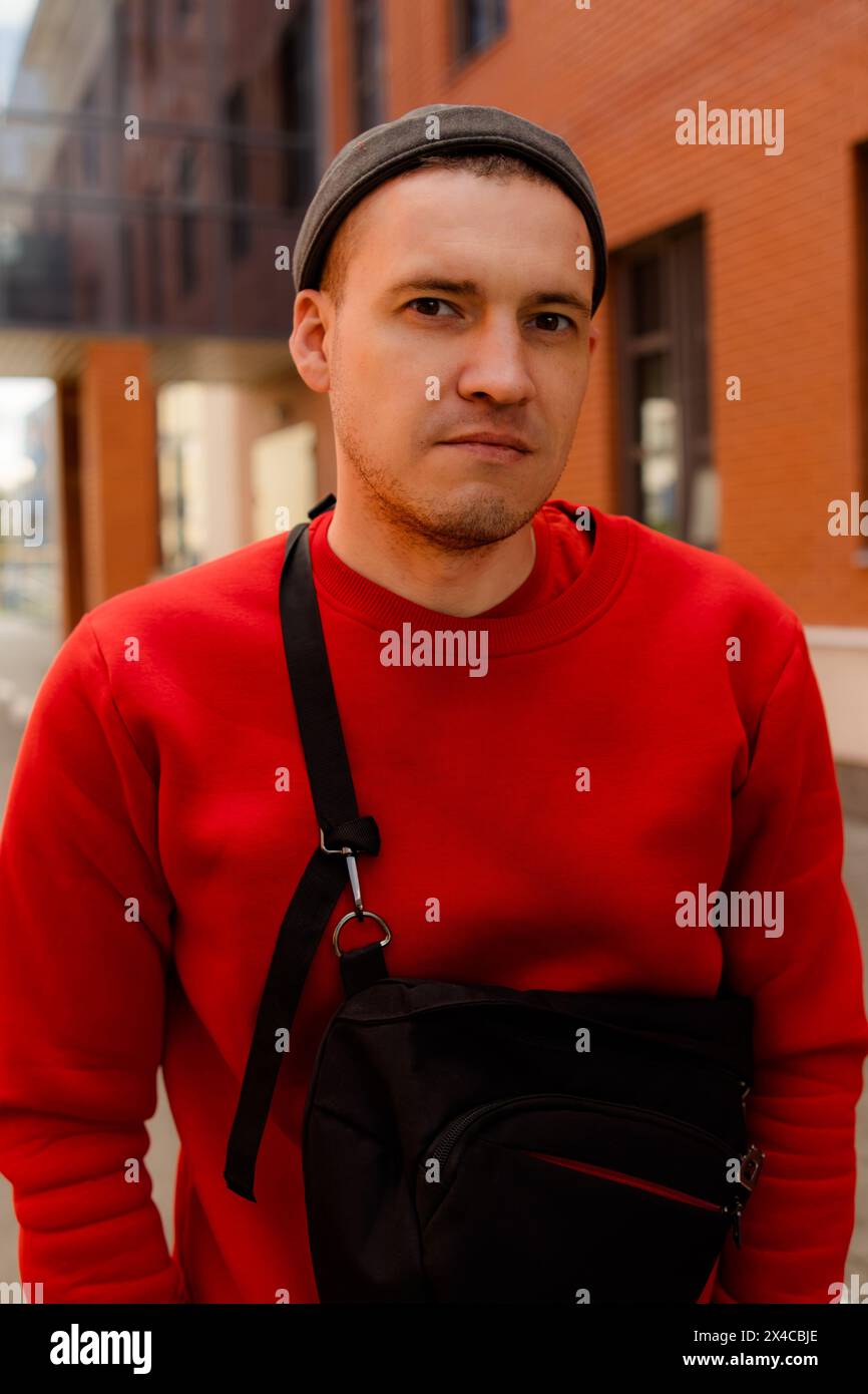 Man in Red Sweater and Black Fanny Pack Stock Photo - Alamy