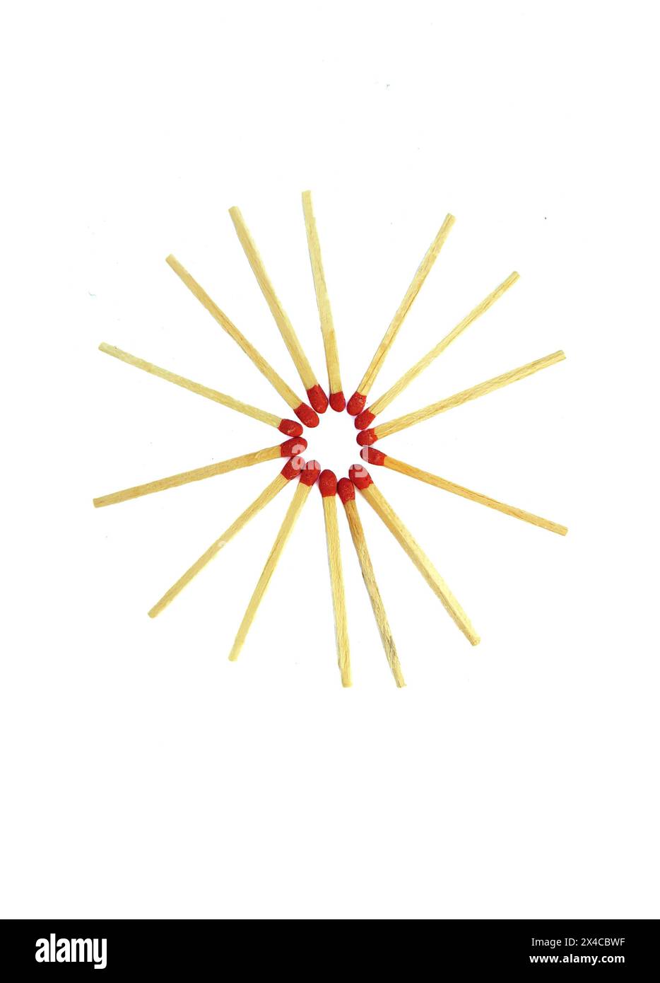 Close-up of a red matchstick arranged in round shape in white ...