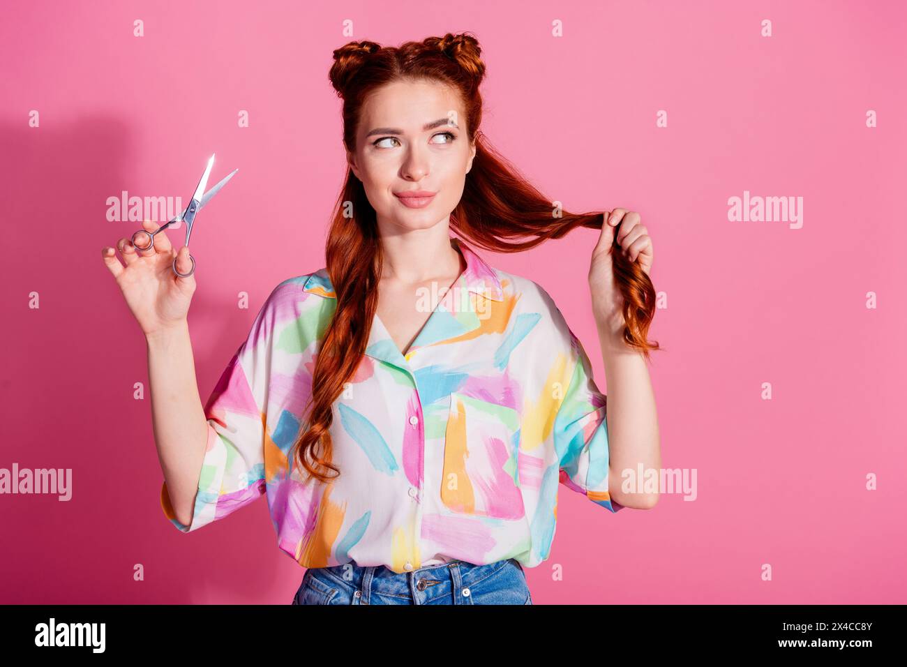 Photo of cute girl dressed colorful blouse look at red tail in arm hold ...