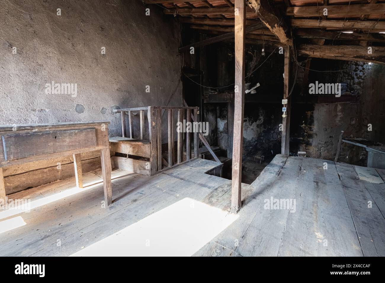 interior of an old abandoned stone house typical of northern portugal ...