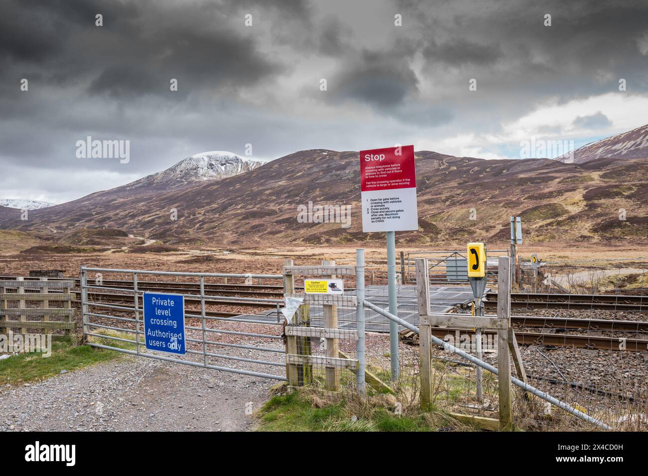 STOP, warning sign at a private locked and gated level crossing near ...