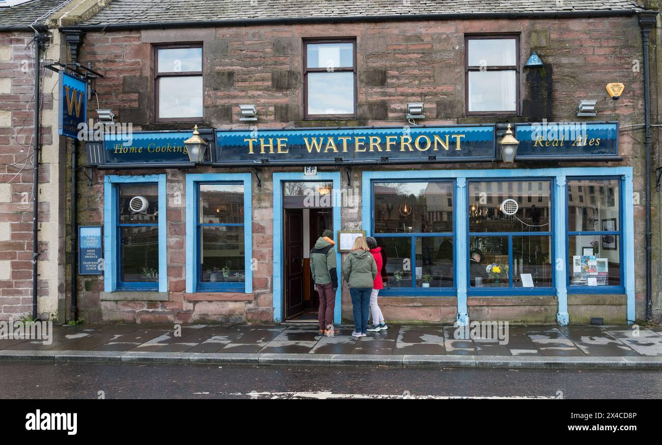 Customers looking at the menu outside the Waterfront pub and restaurant ...