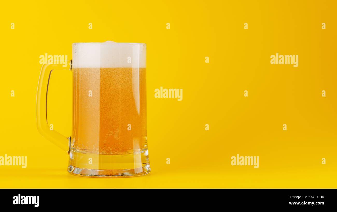Beer mug. Over yellow background with copy space Stock Photo - Alamy