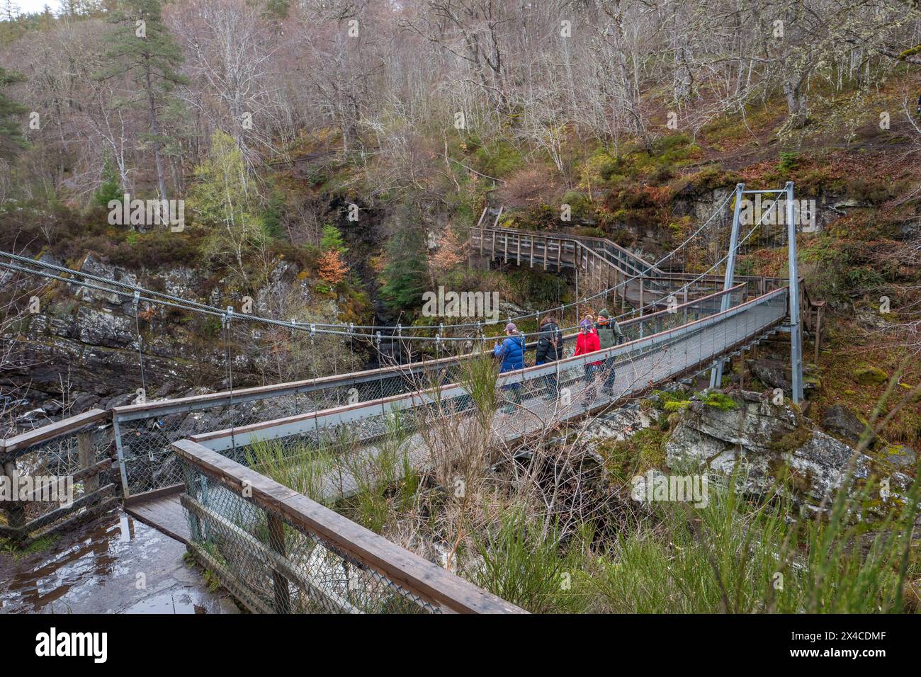 The suspension bridge which crosses over the Black water river at Rogie ...