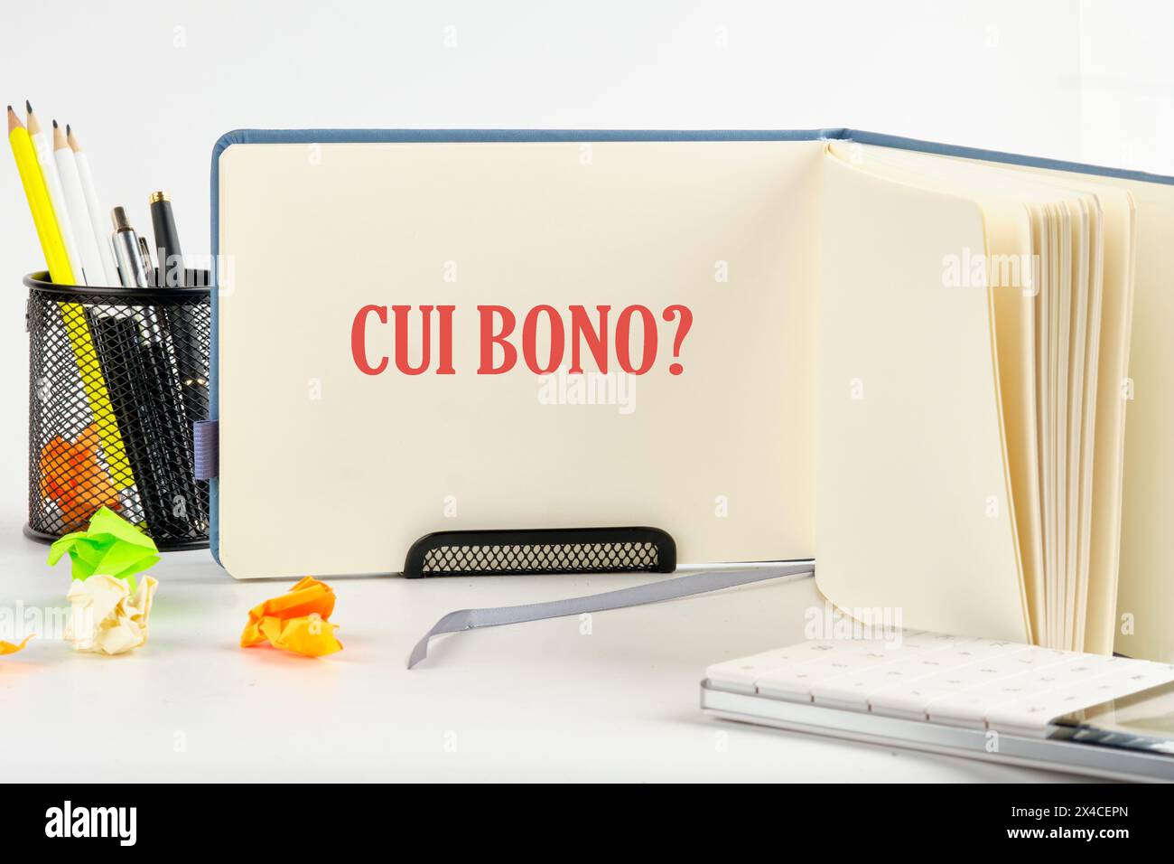 CUI BONO (to whose benefit) question on a blank sheet of an open ...