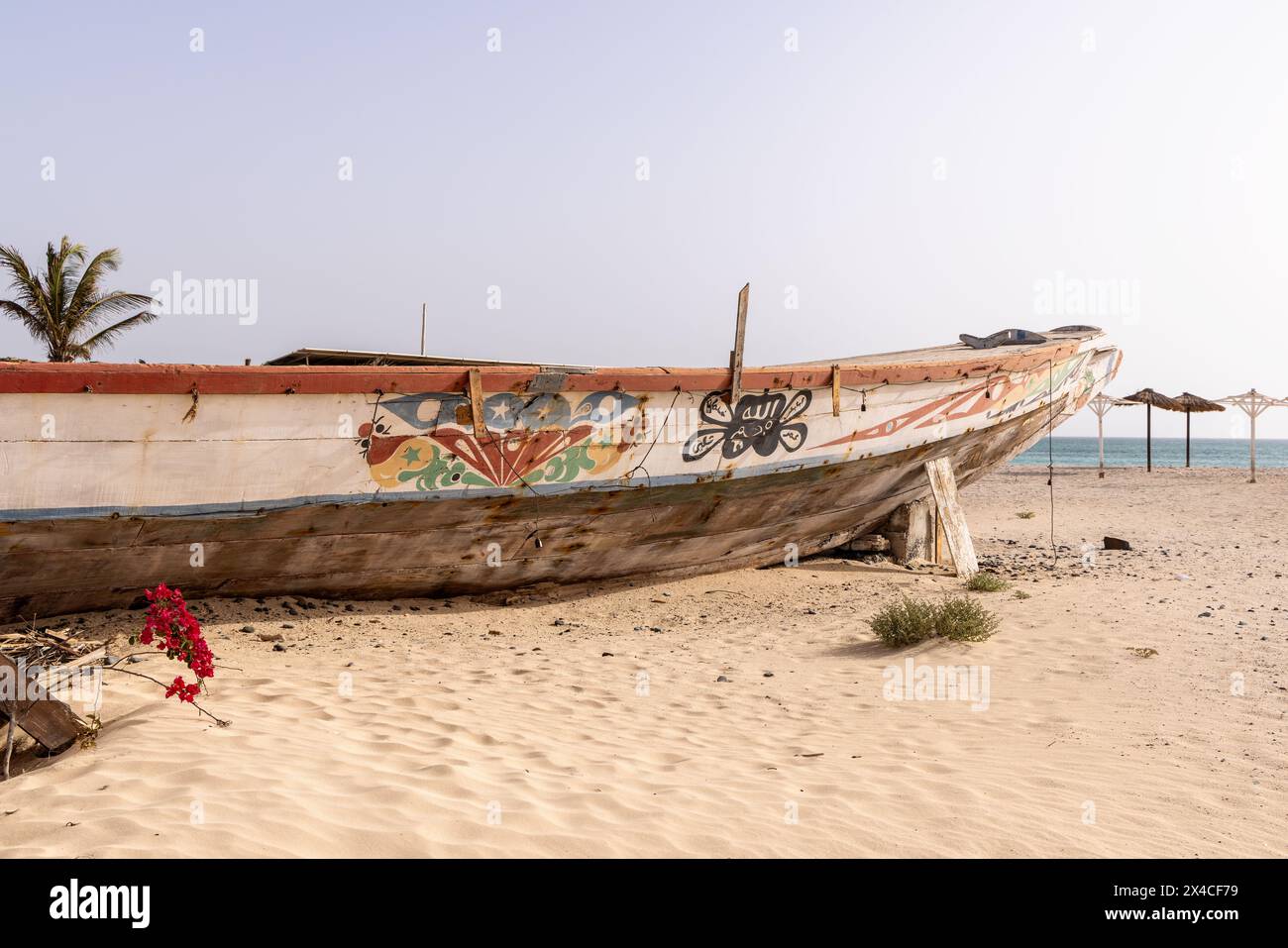 Close up of a colourful old wooden fishing boat moored on a beach in ...