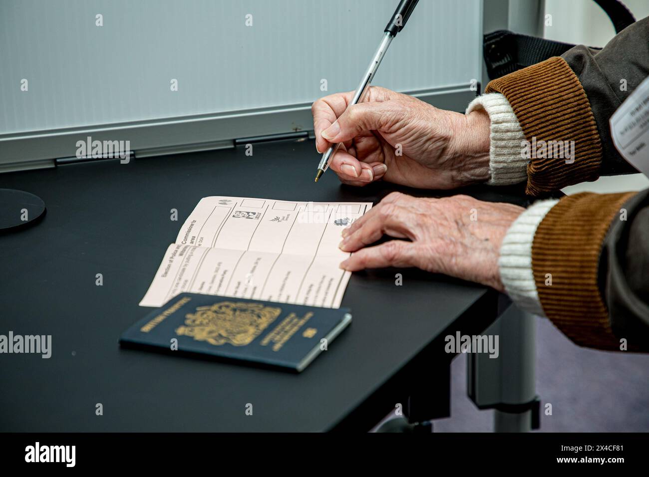Salisbury, England, UK, 2nd May, 2024 Female voter placing X on ballot ...