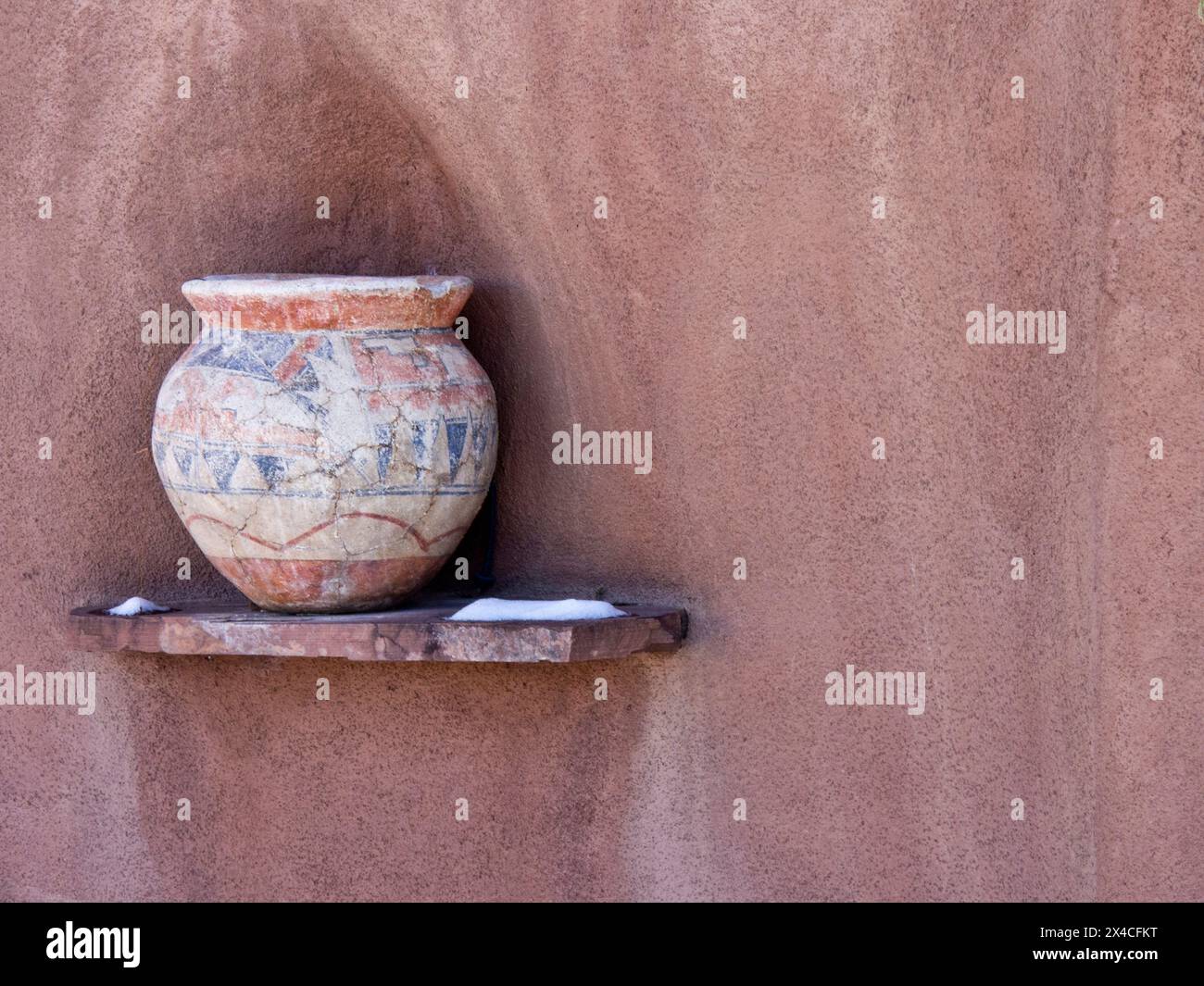 USA, New Mexico, Sante Fe. Old Aztec pottery on a shelf of an adobe ...