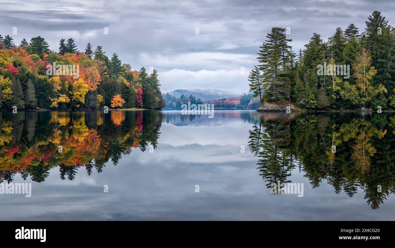 USA, New York, Adirondacks. Panoramic view of evening reflections on ...