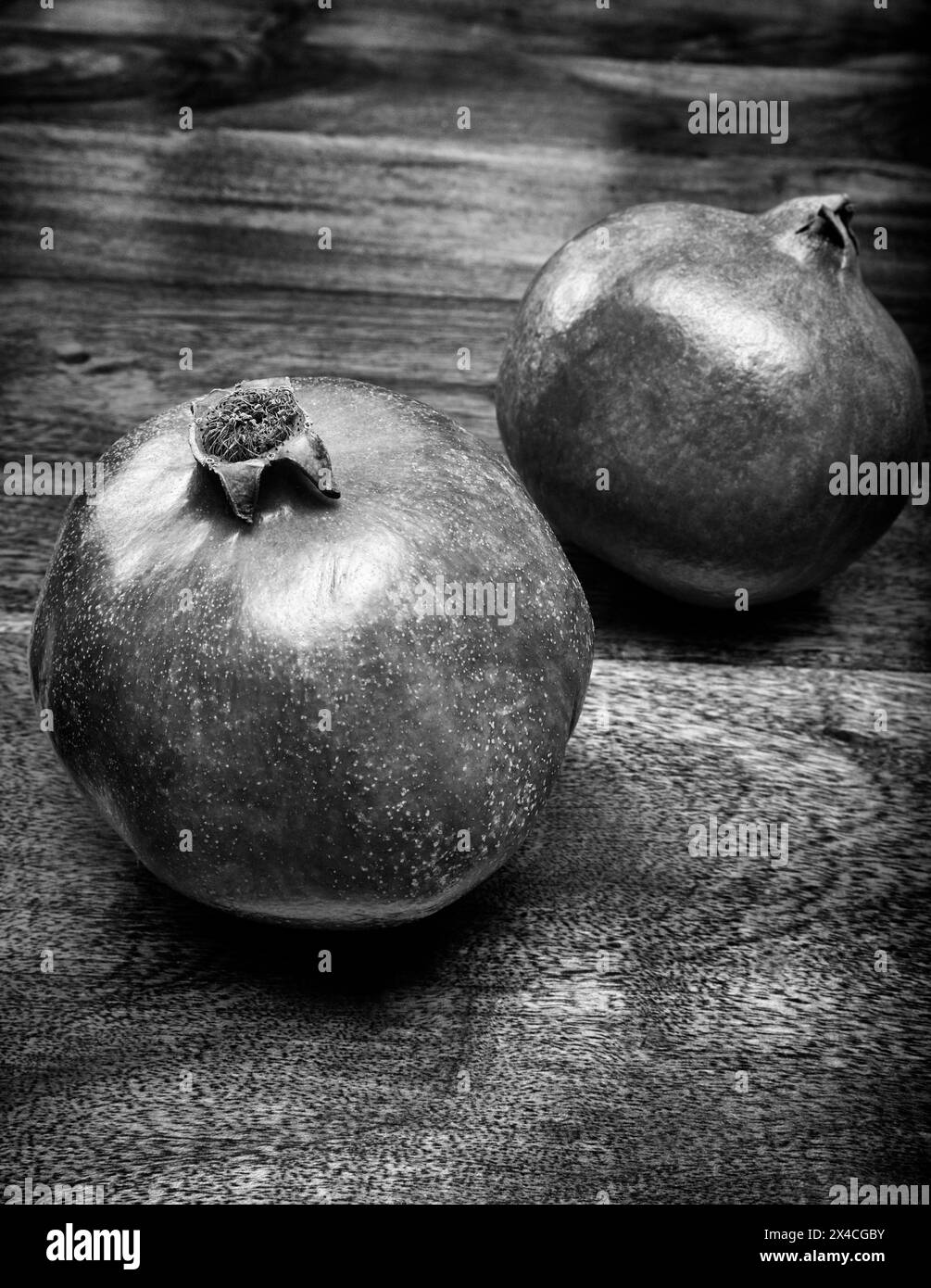 Ripe pomegranate fruit on Black and White Stock Photos & Images - Alamy