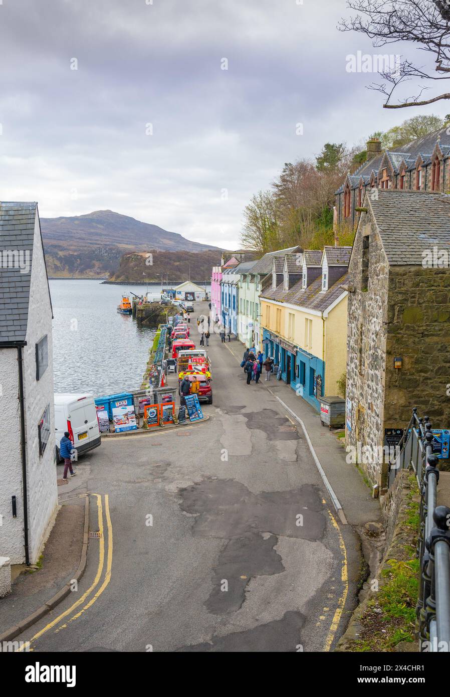 The pastel colourful painted buildings along the harbour wall in the ...