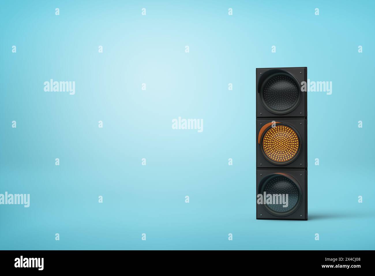 Orange traffic light on a modern signal post Stock Photo - Alamy