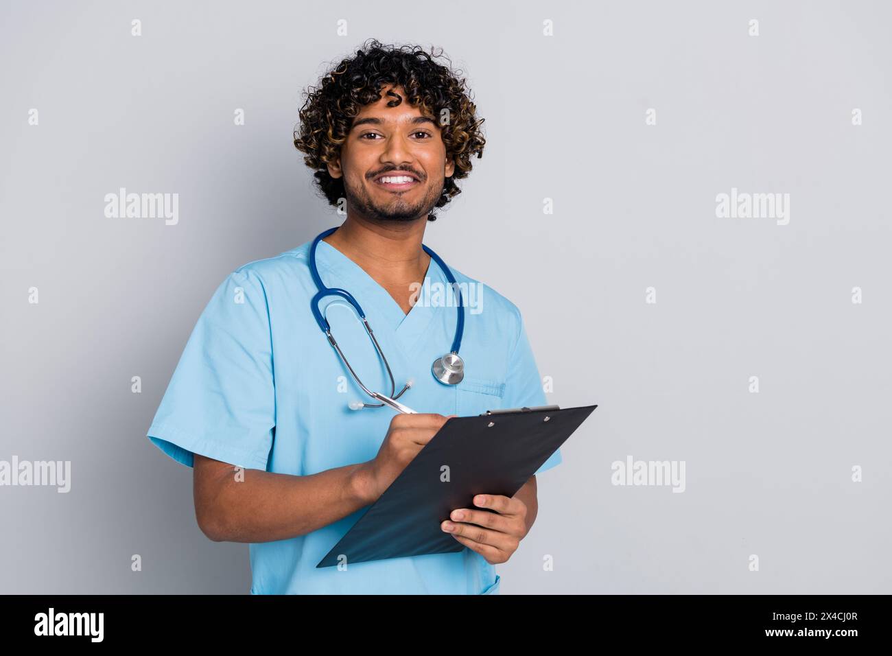 Photo of doctor guy hold checklist writing isolated grey color ...