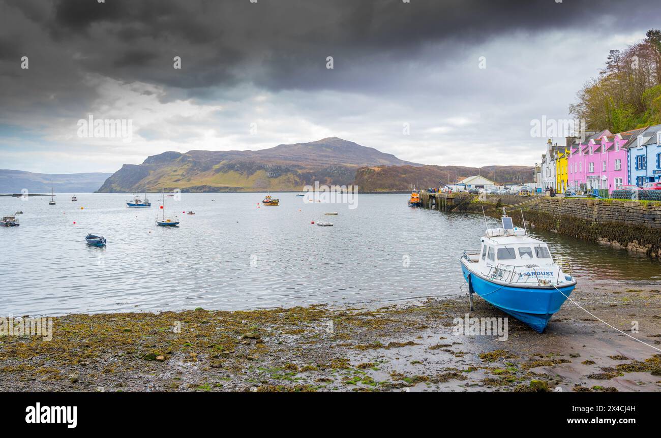 The pastel colourful painted buildings along the harbour wall in the ...