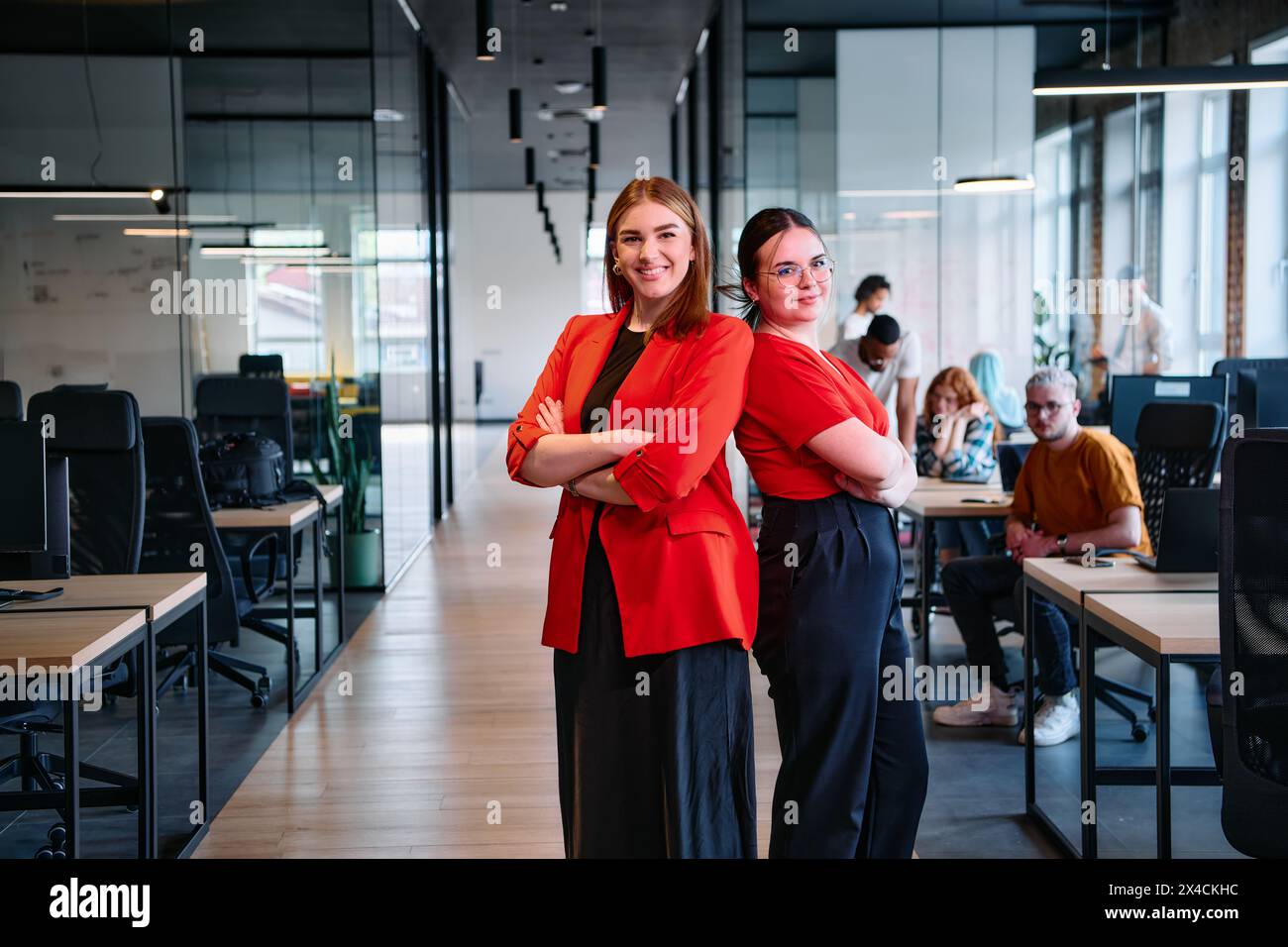 Group of determined businesswomen confidently pose side by side in a ...