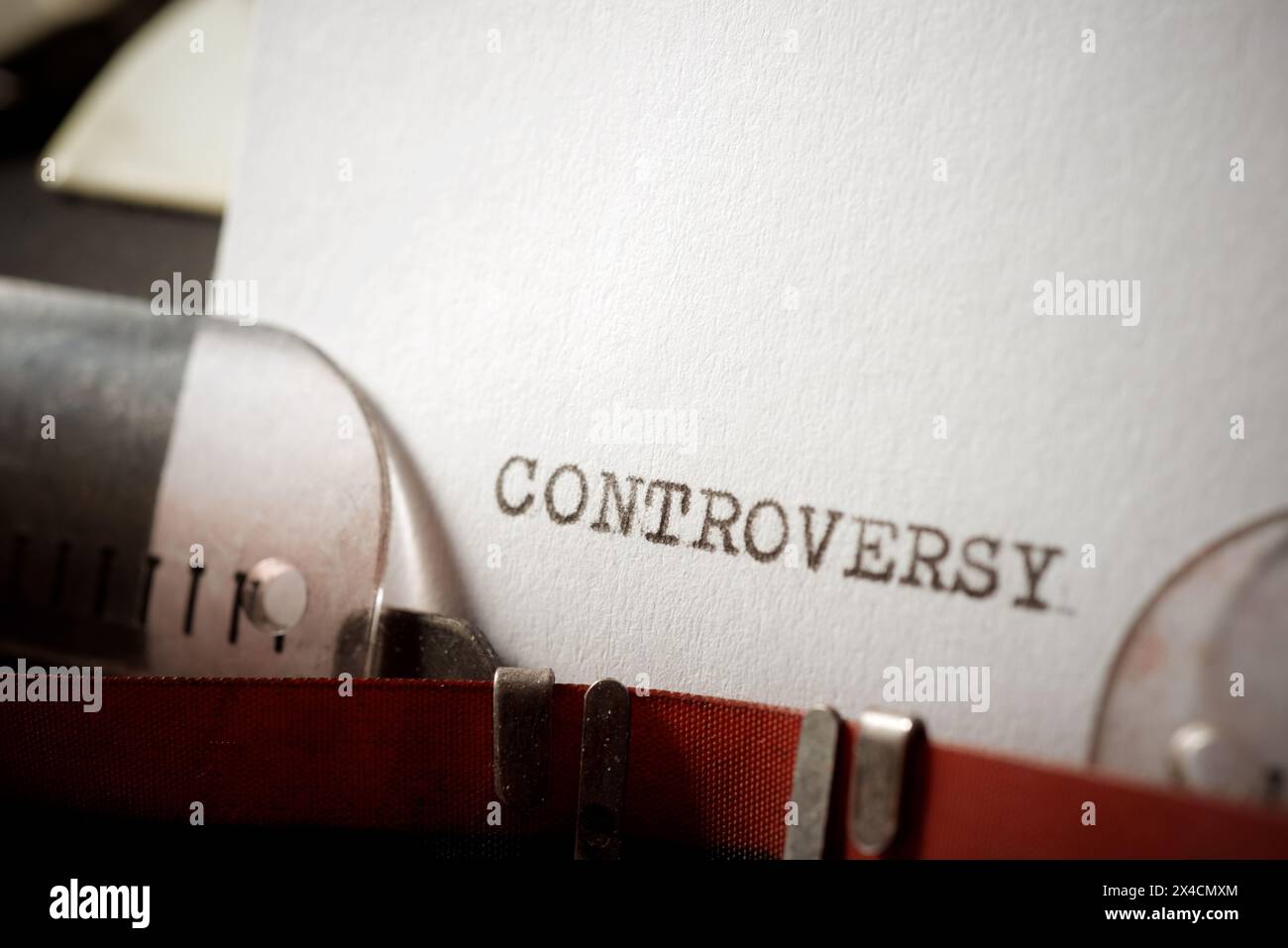 Controversy word written with a typewriter Stock Photo - Alamy