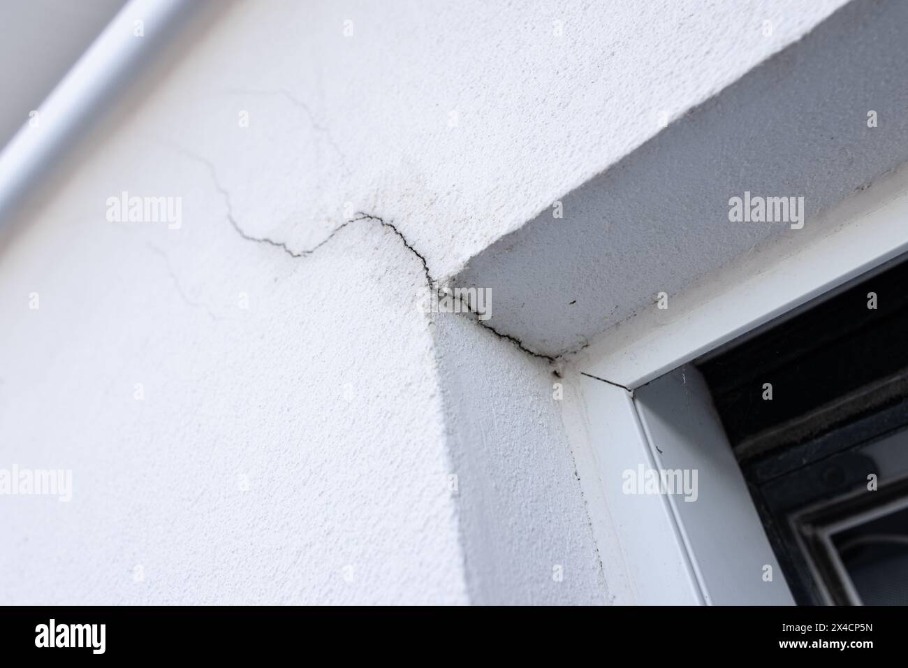 Close up of a a crack in the facade insulation cladding near the window ...