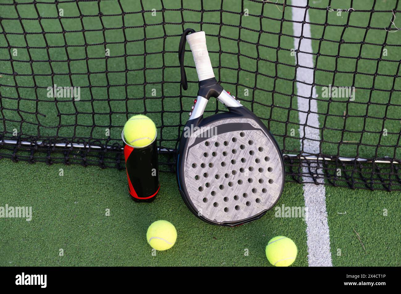 Paddle tennis objects on grass court Stock Photo - Alamy