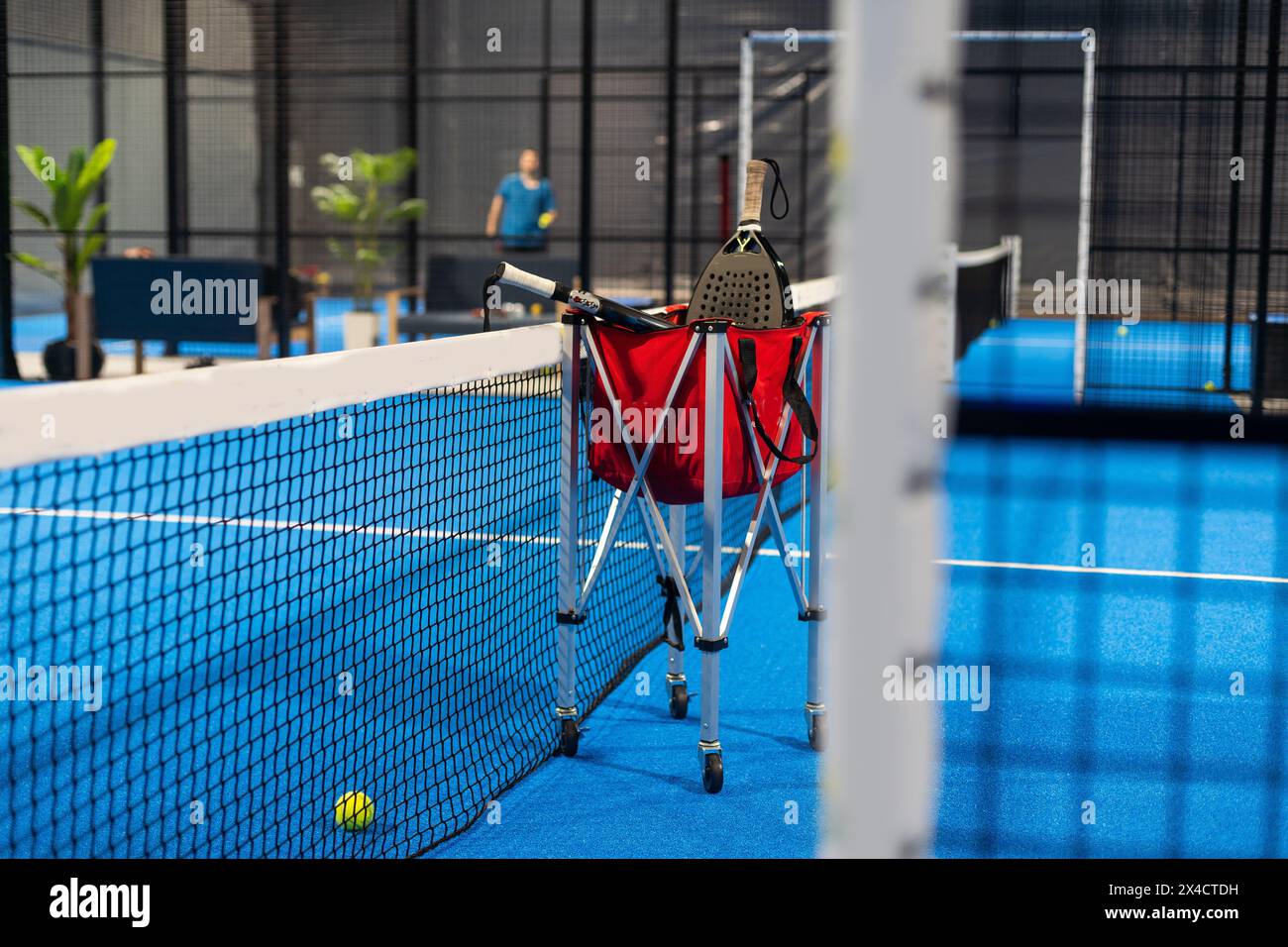 Paddle tennis rackets, balls and basket in court still life Stock Photo ...