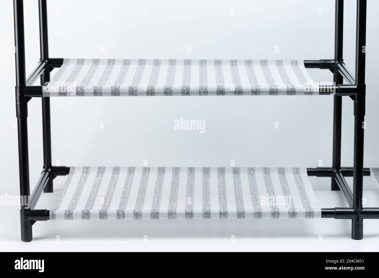 Empty shelf in shoe rack isolated on white studio background Stock ...