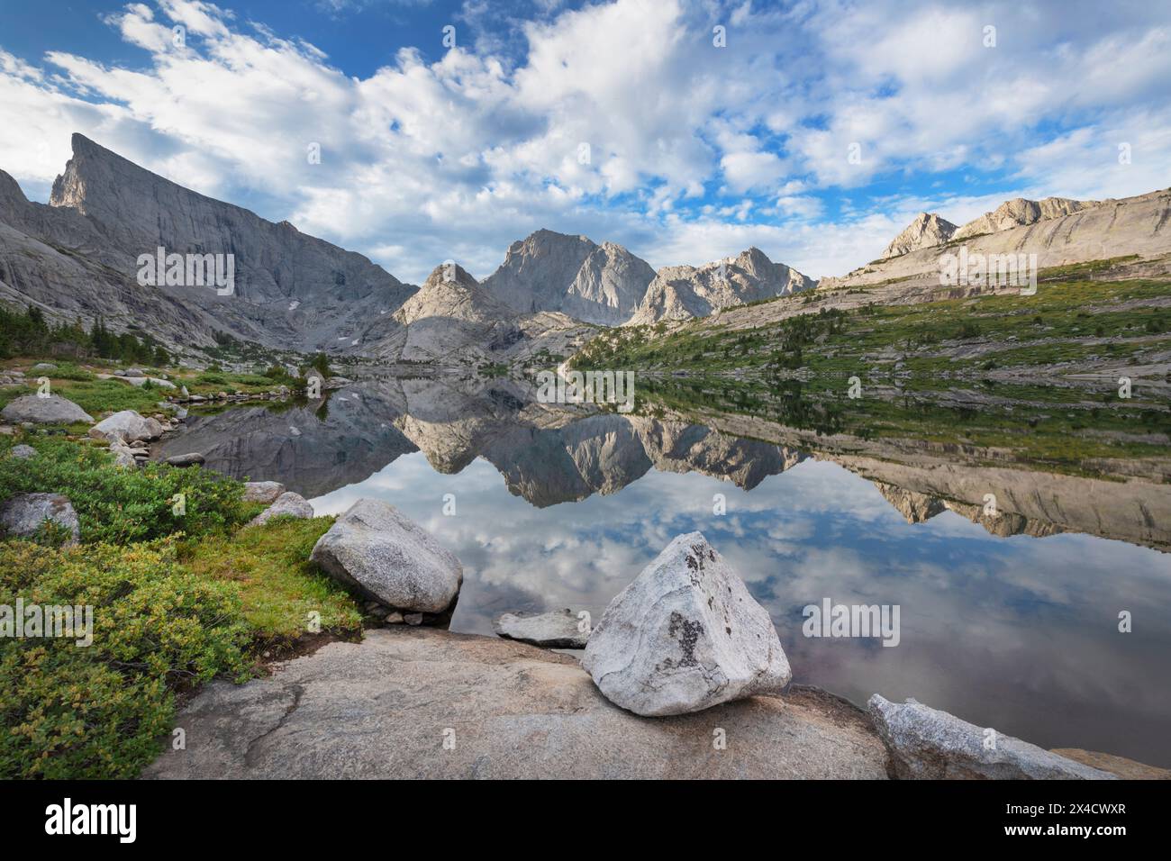 East Temple and Temple Peaks reflected in deep lake. Bridger Wilderness ...