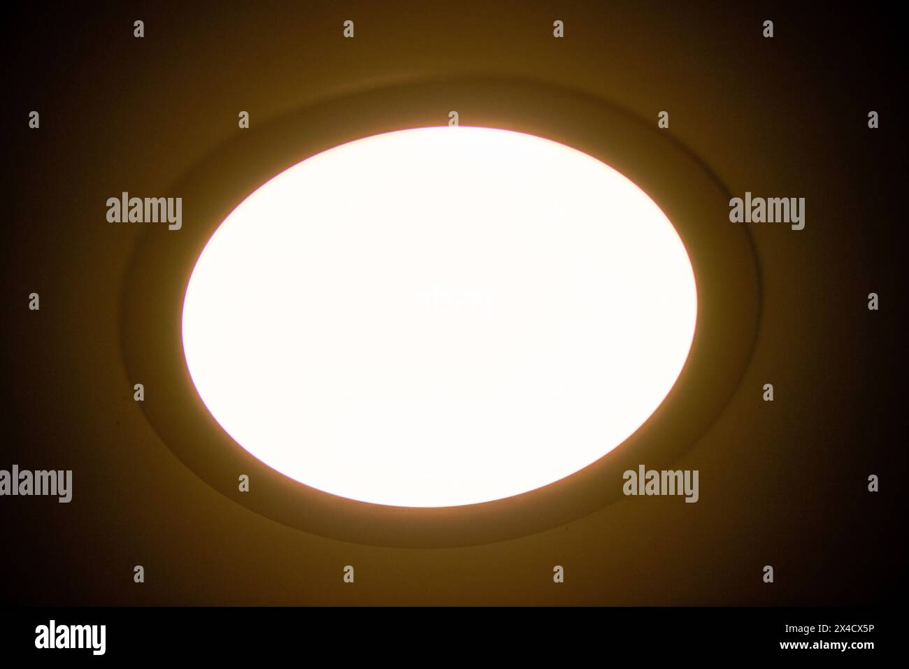 Efficient, stylish, and modern LED ceiling lamp illuminating the room ...