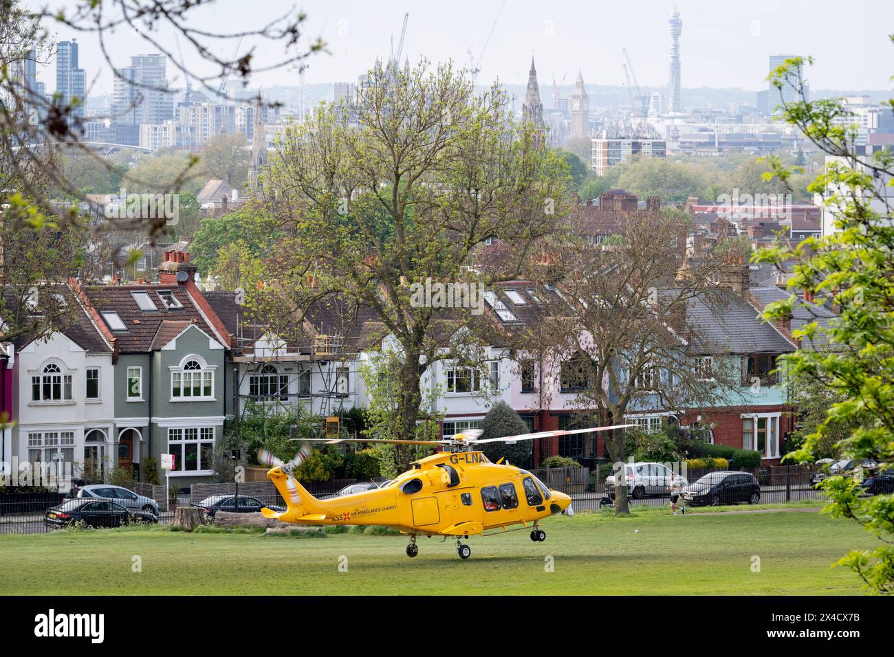An air ambulance helicopter touches down in Ruskin Park, a south London ...