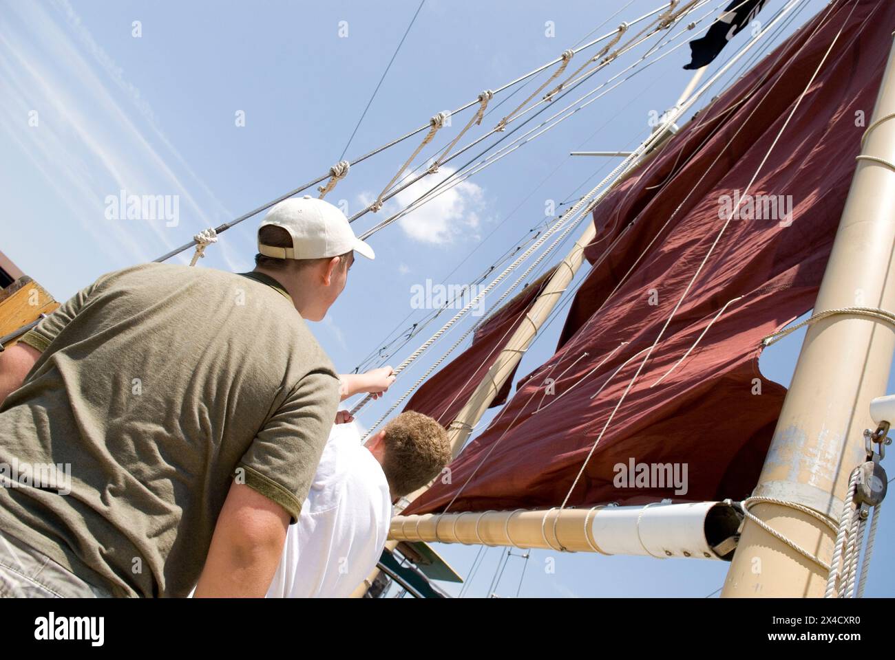 Two caucasian boys raise sail hi-res stock photography and images - Alamy
