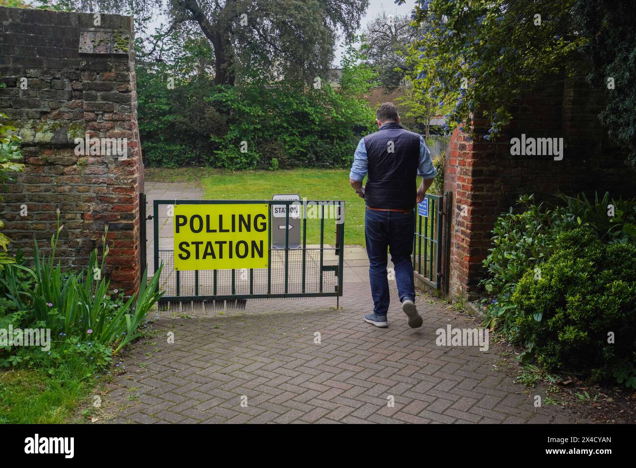 London, UK. 2 May, 2024. A voter enters a polling station inside St ...