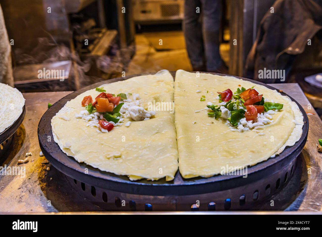 Cairo, Egypt. Crepes being made at a shop on El Moez street in Old ...