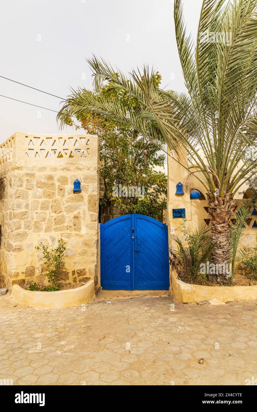 Faiyum, Egypt. Blue gate in a stone wall in Egypt Stock Photo - Alamy
