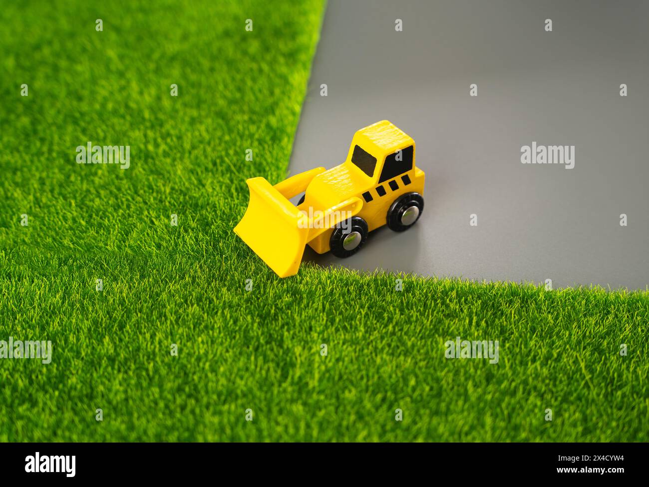A bulldozer destroys nature, clearing the area for new construction ...