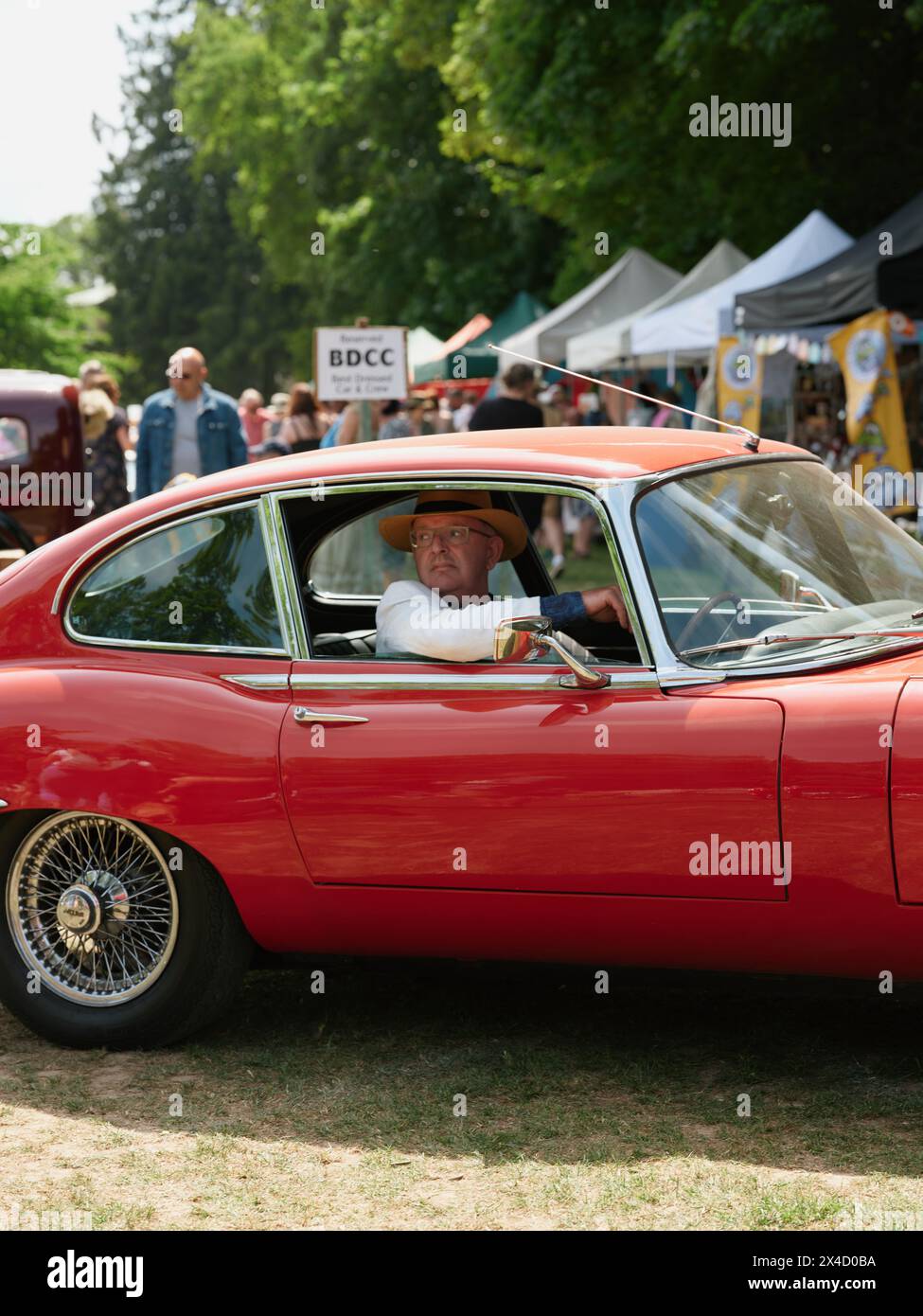 Classic car owners relaxing at a vintage car show in England, UK ...