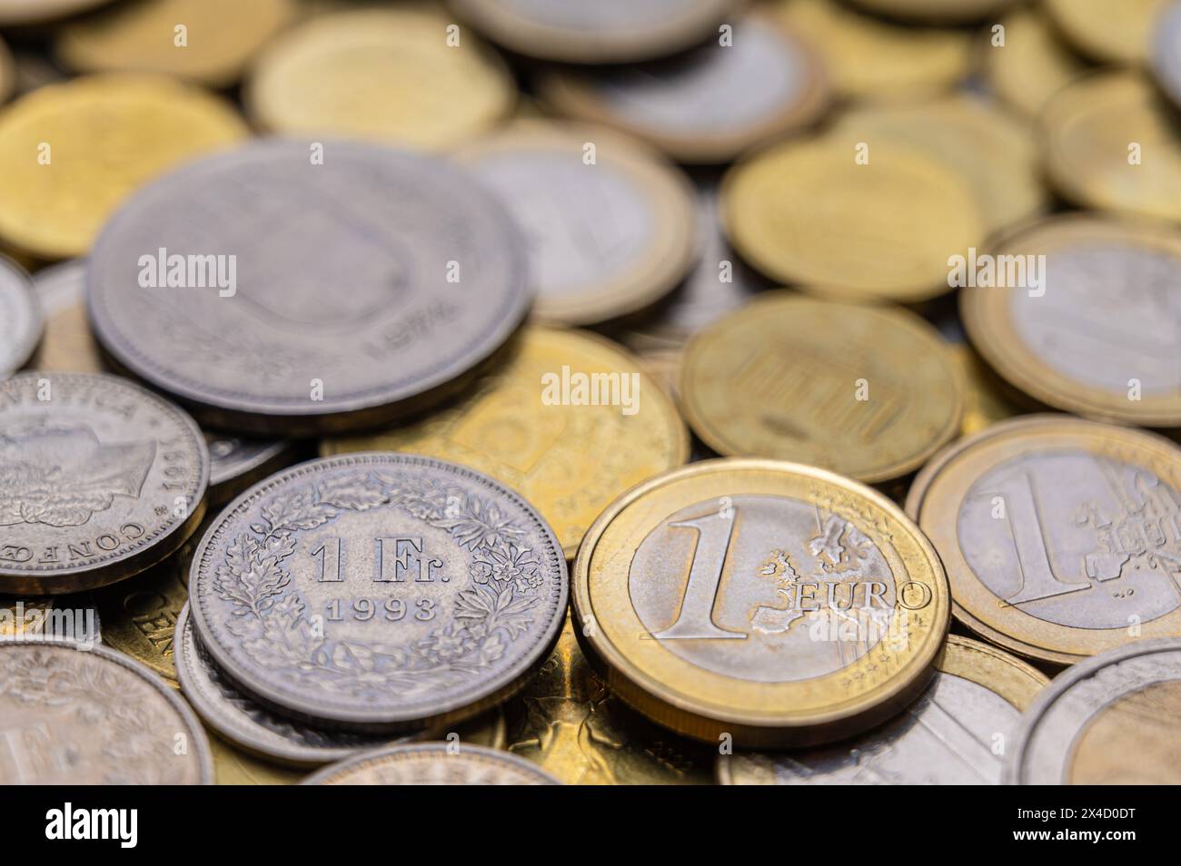 Euro and Swiss Franc coins next to each other, 1 euro and 1 CHF coins ...