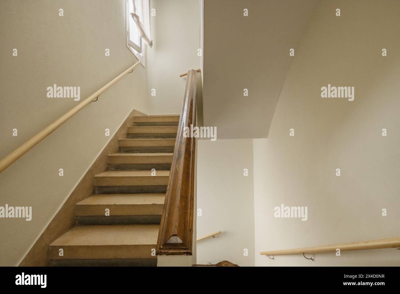Interior stairs of a single-family home with brick balustrades with ...