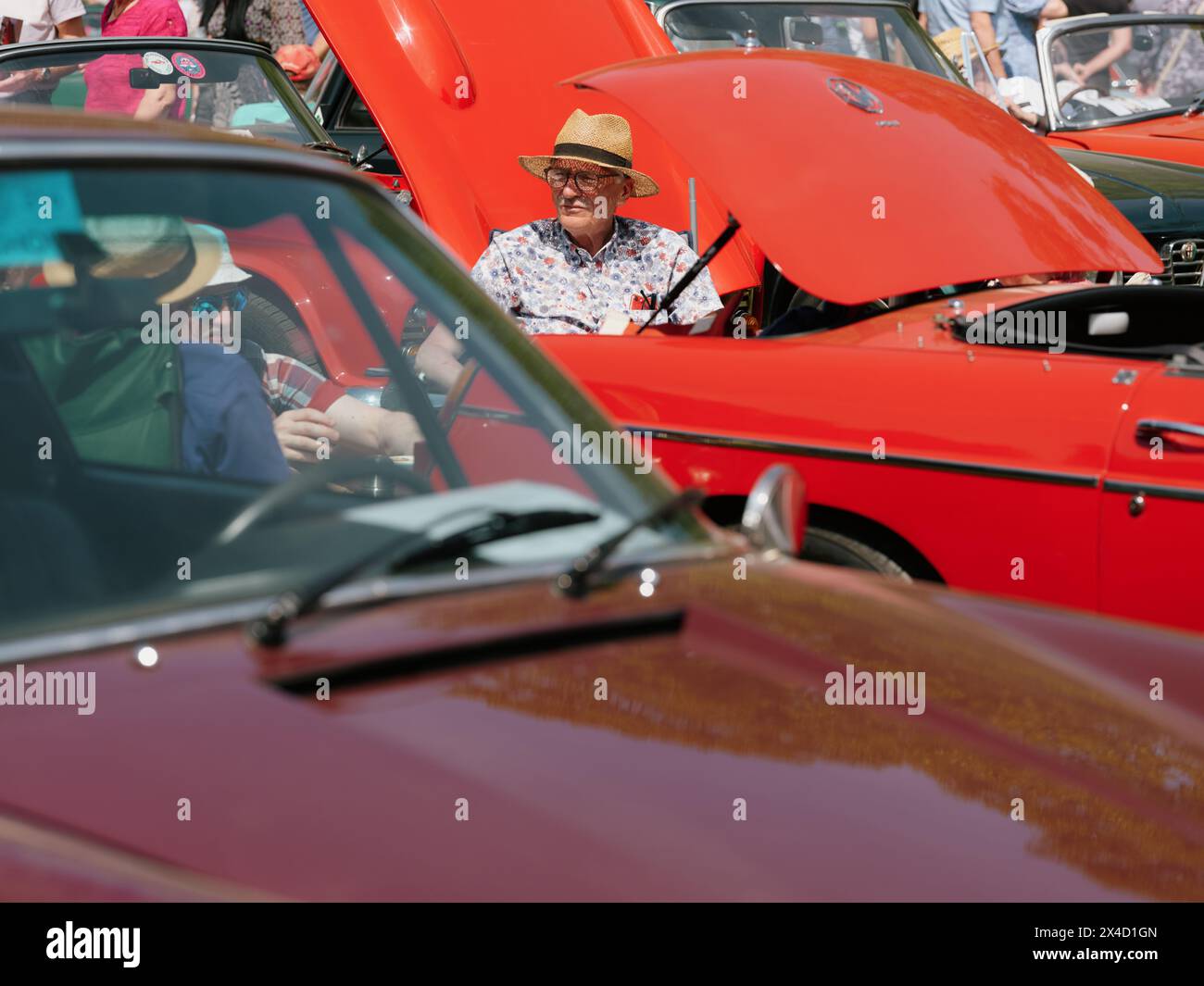 Classic car owners relaxing at a vintage car show in England, UK ...