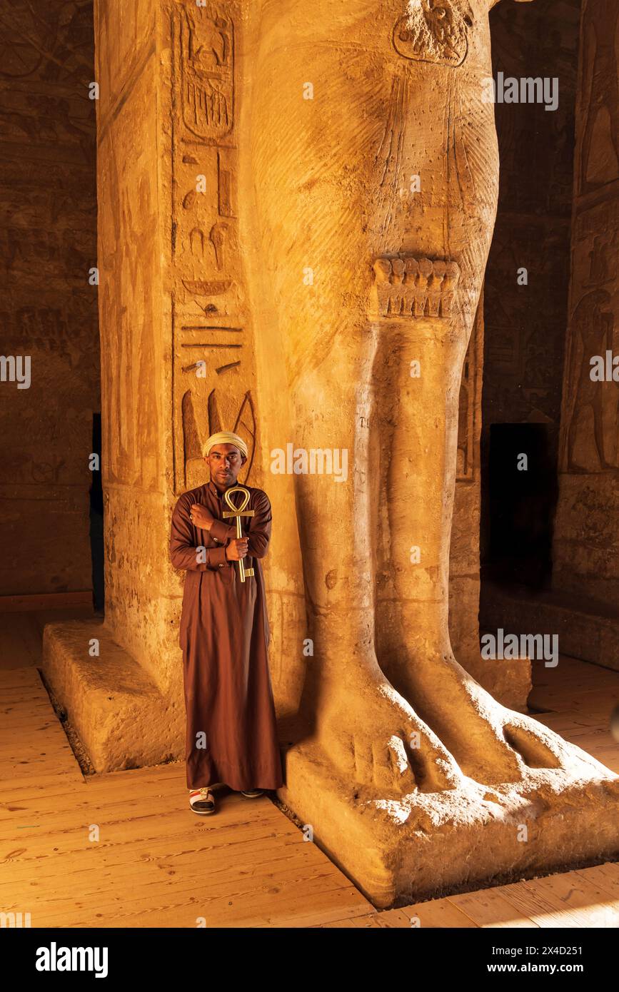Abu Simbel, Aswan, Egypt. Caretaker holding a large key in the shape of ...