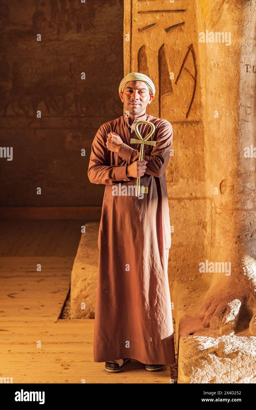 Abu Simbel, Aswan, Egypt. Caretaker holding a large key in the shape of ...