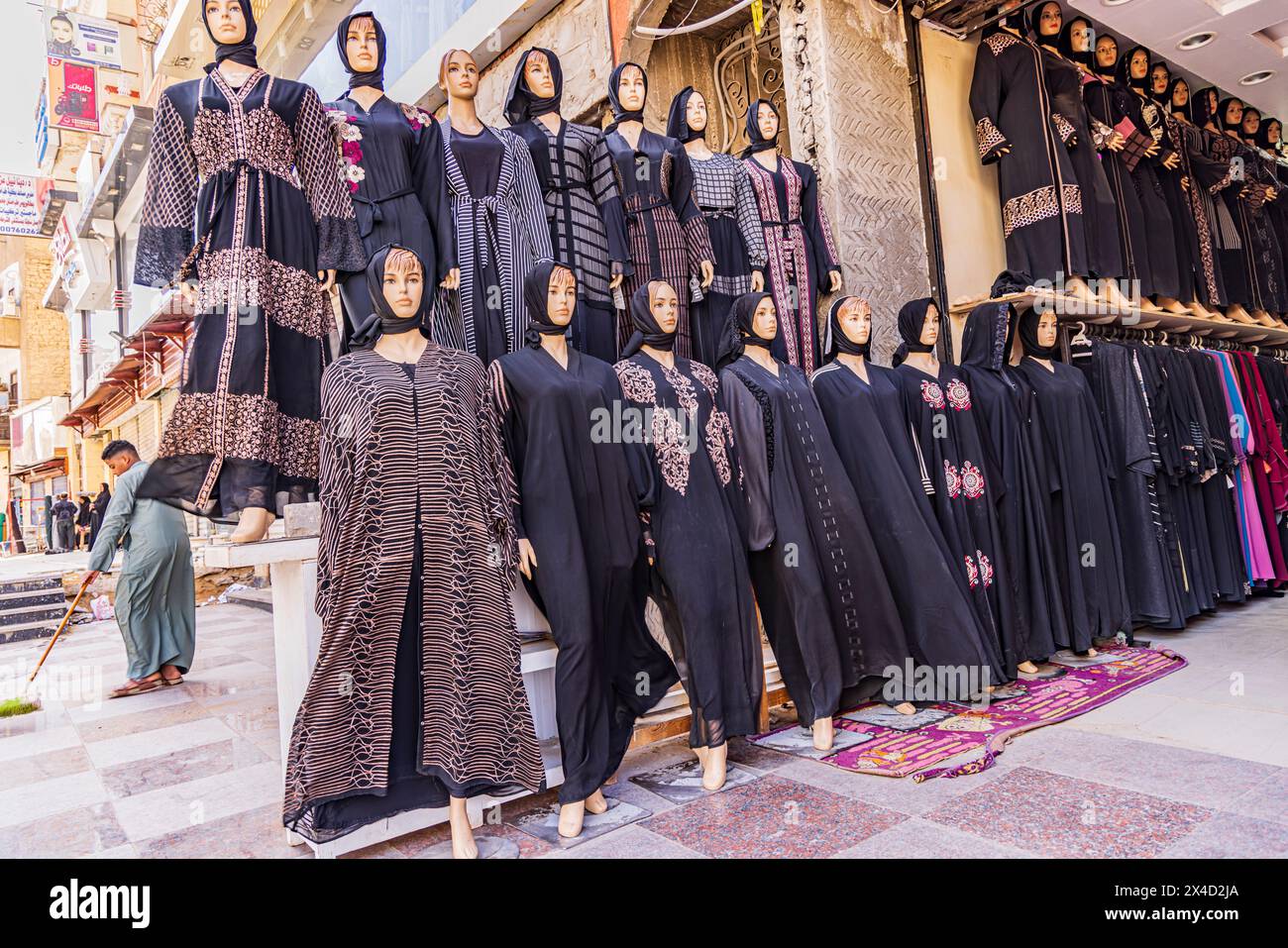Thebes, Luxor, Egypt. Traditional abayas for sale at a clothing store ...