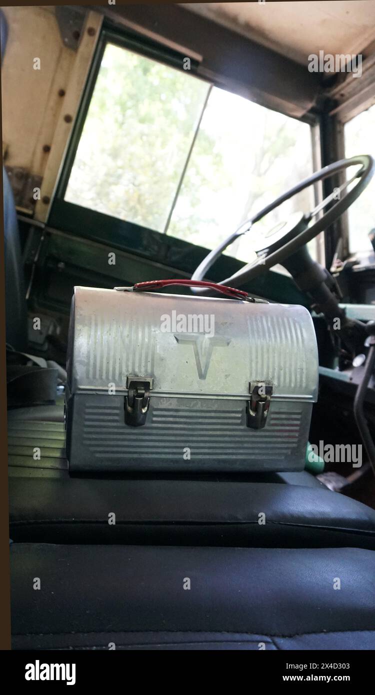 A lunch box on the seat of a 1967 Landrover. photo by Dennis Brack ...