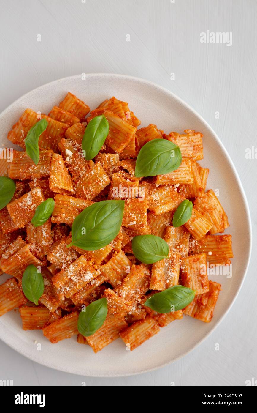 Homemade Vodka Rigatoni Pasta with Parmesan Cheese and Basil, top view ...