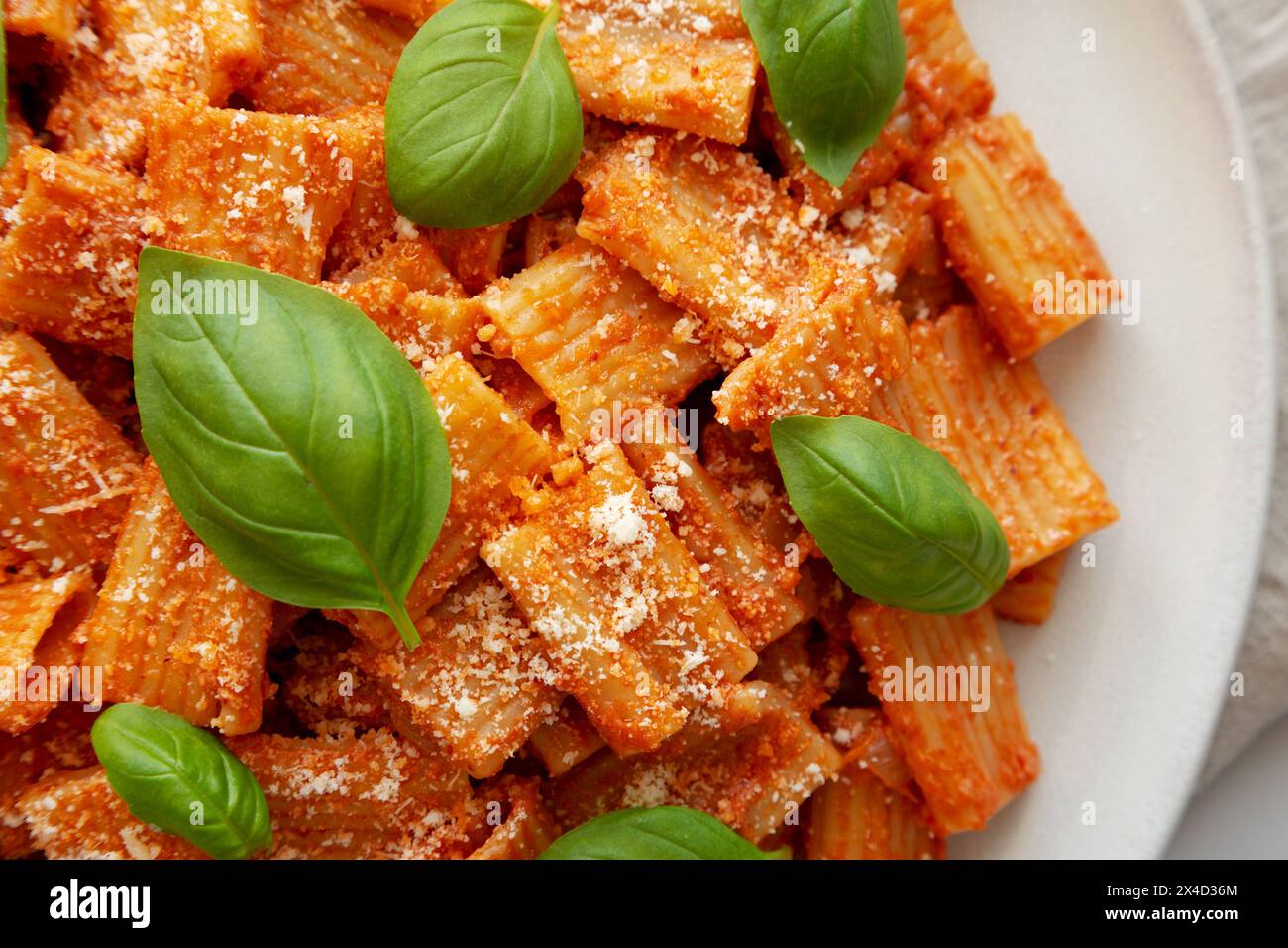 Homemade Vodka Rigatoni Pasta with Parmesan Cheese and Basil, top view ...