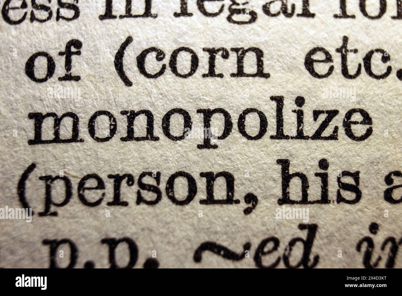 Word monopolize on dictionary page, macro close-up Stock Photo - Alamy