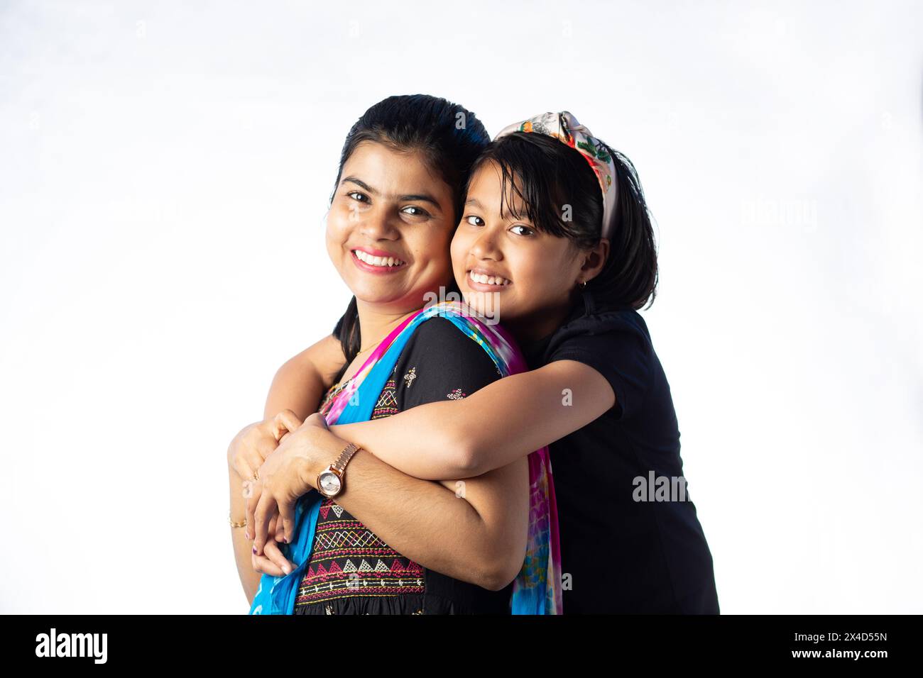 Indian mother and child daughter embracing hugging each other with ...