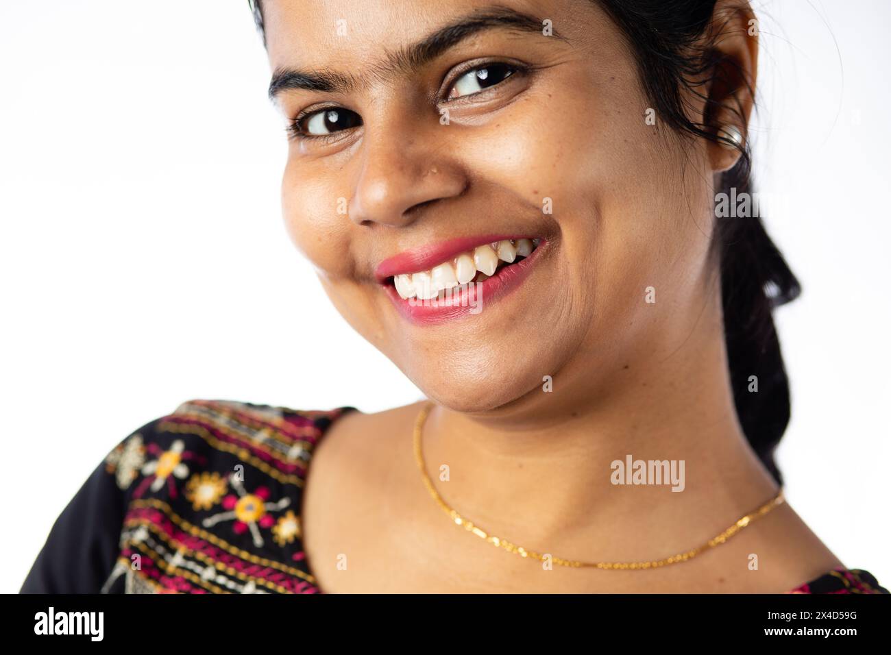 A pretty beautiful Indian female smiling with dimple and looking at ...